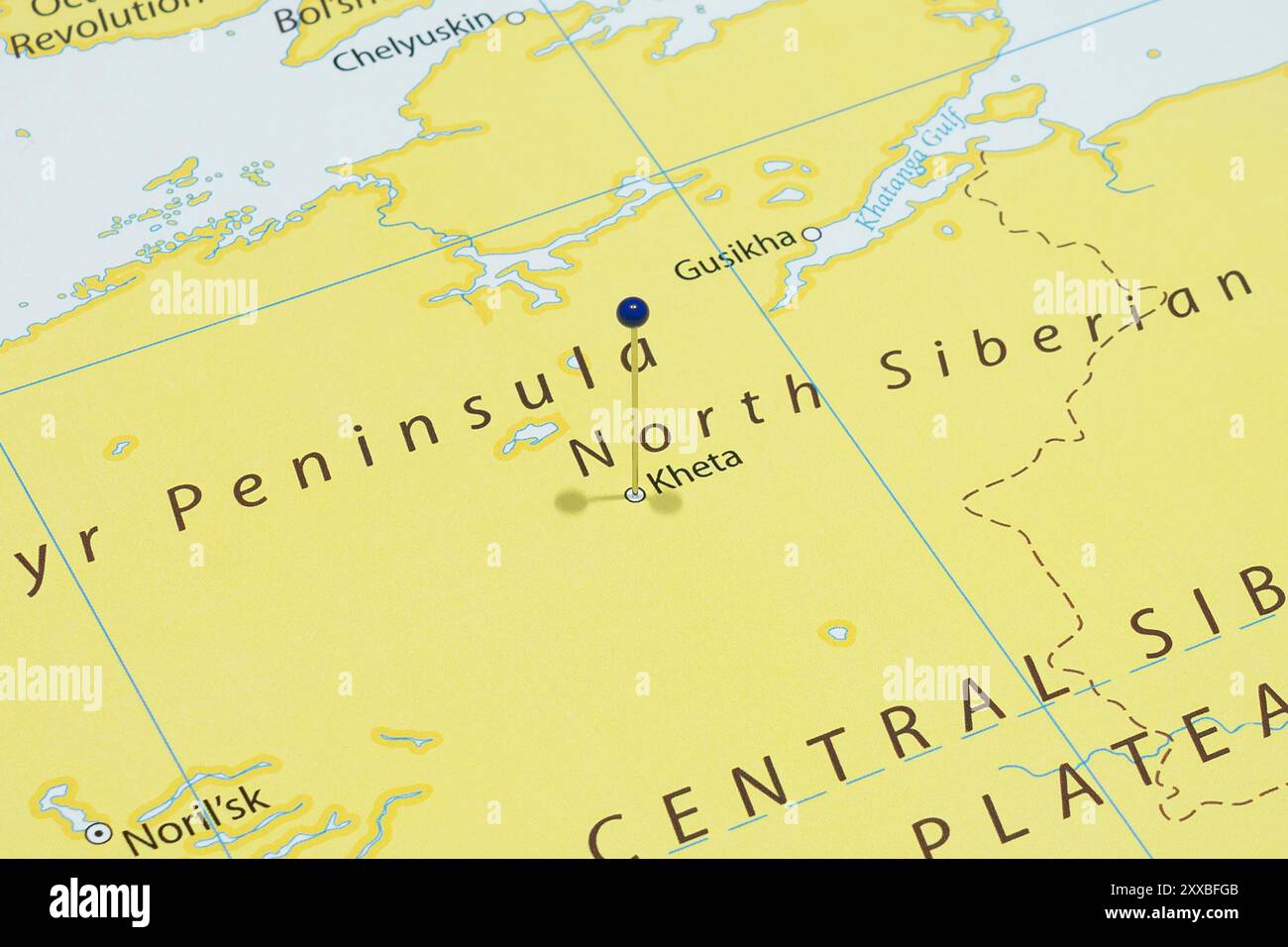 Close up to a Kheta city with a blue pin needle into Russia country ...