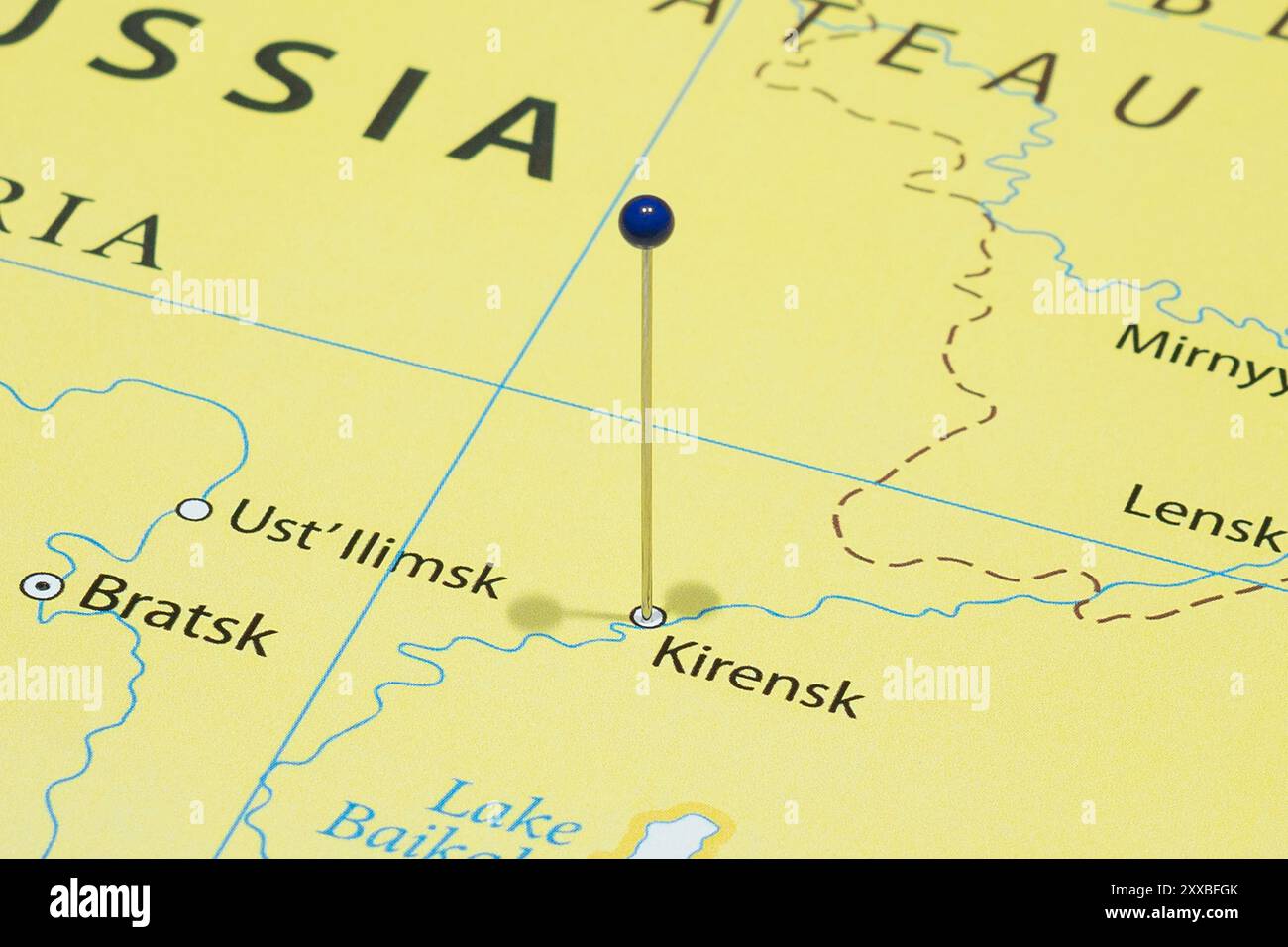 Close up to a Kirensk city with a blue pin needle into Russia country ...