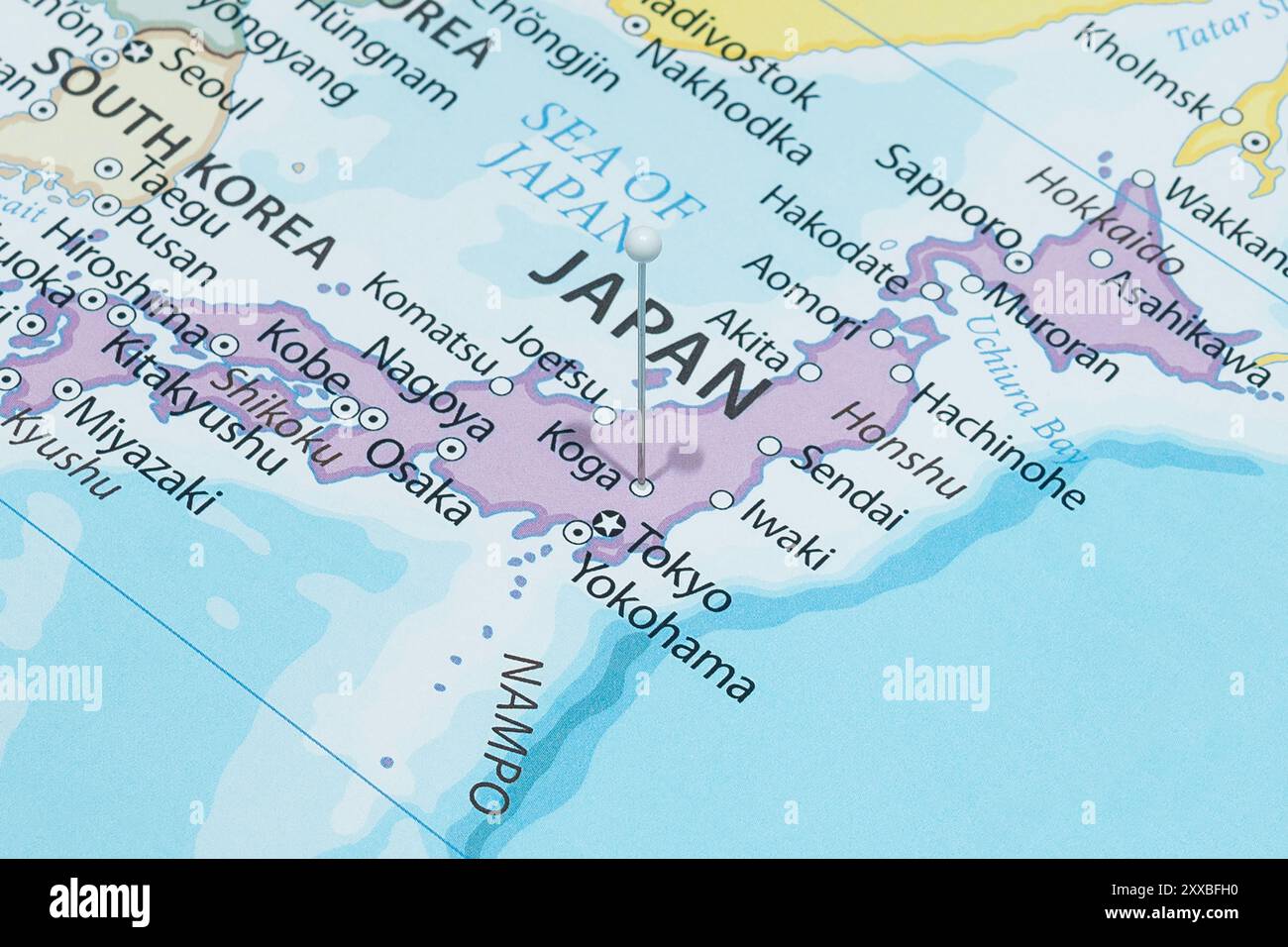 Close up to a Koga city with a white pin needle into Japan country ...