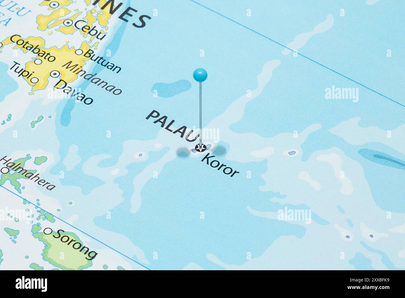 Close up to a Koror city with a light blue pin needle into Palau ...