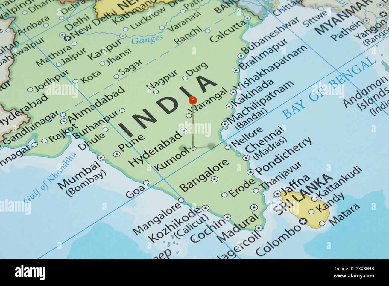 Close up to a Kurnool city with an orange pin needle into India country ...