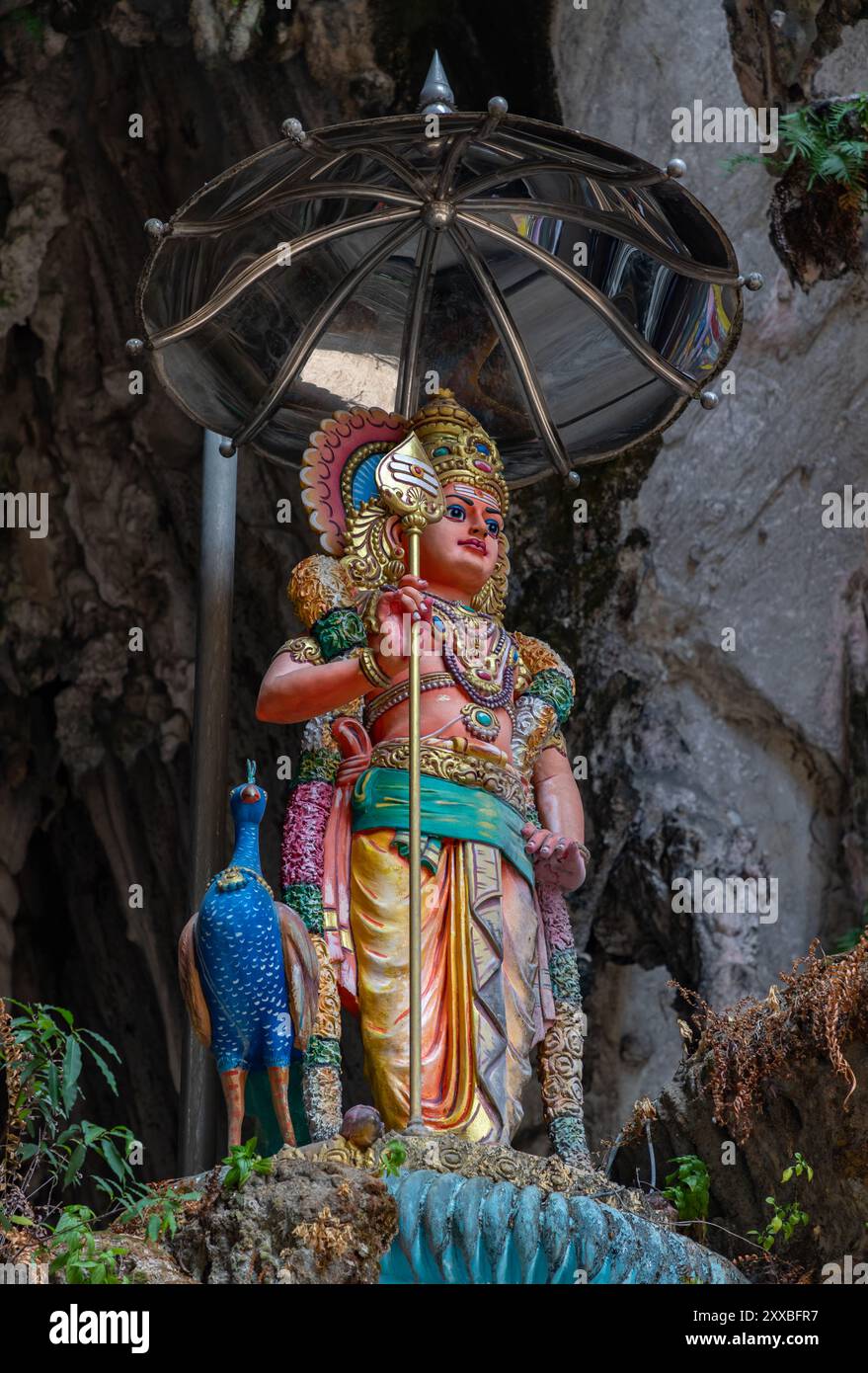 A picture of a small statue of Arulmigu Murugan at the Batu Caves Stock ...