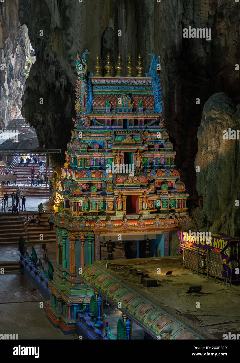 A picture of a colorful Hindu shrine inside of the Batu Caves Stock ...
