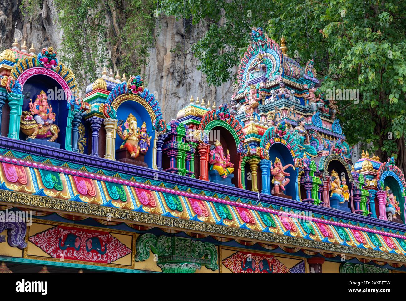 A picture of the colorful buildings near the Batu Caves complex ...