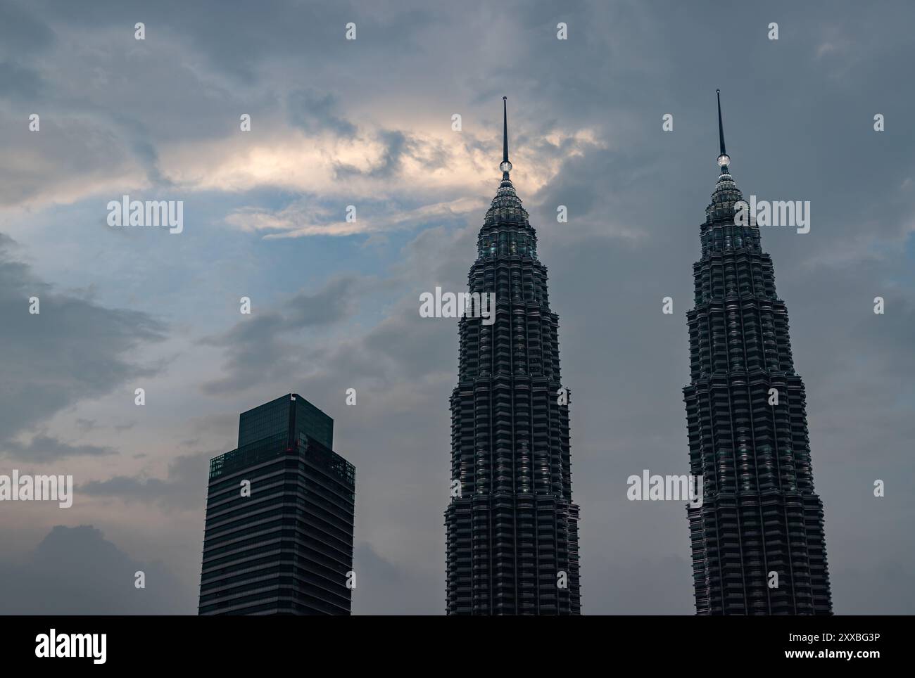 A picture of the upper section of the Petronas Twin Towers at sunset ...