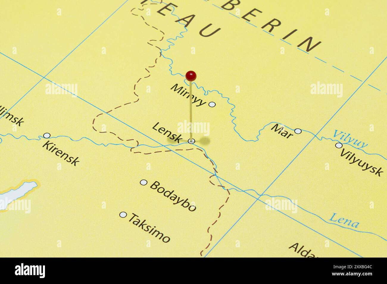 Close up to a Lensk city with a red pin needle into Russia country ...