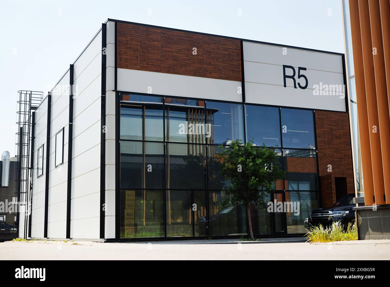Contemporary office building with R5 signage on exterior, featuring ...