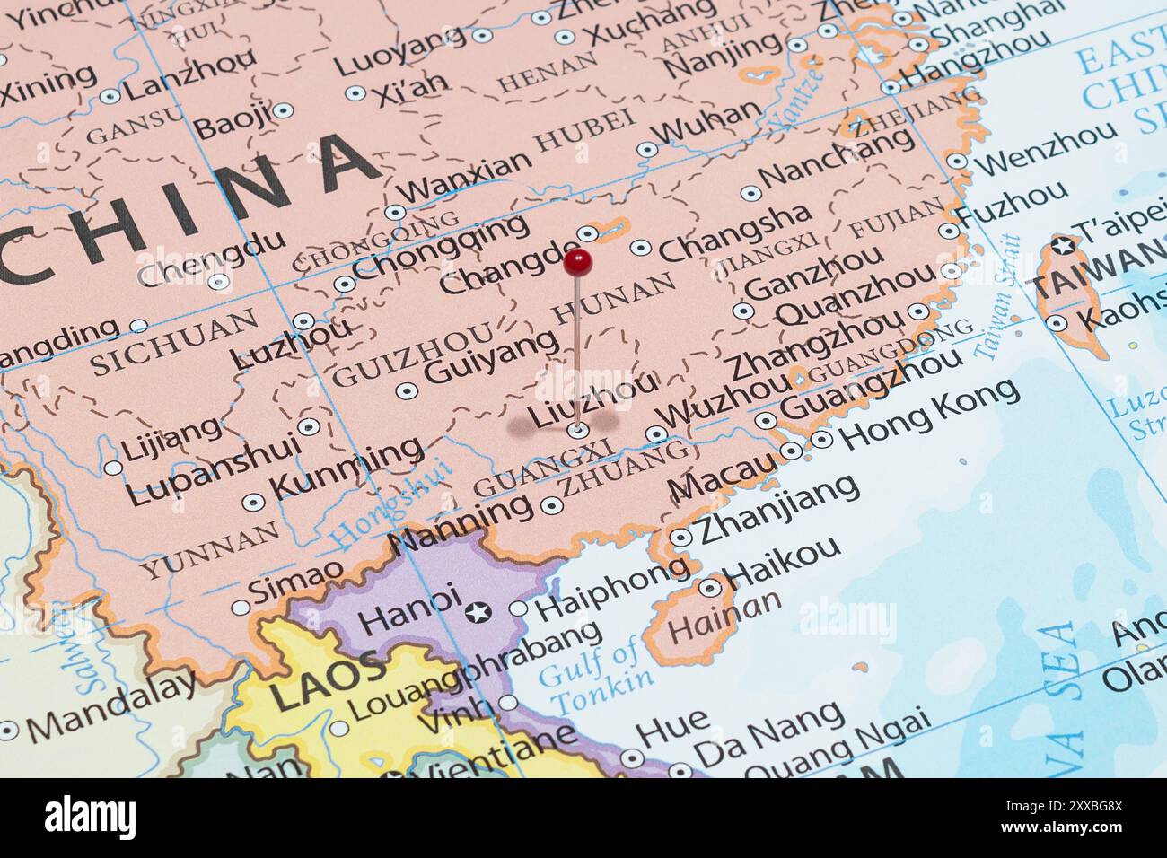 Close up to a Liuzhou city with a red pin needle into China country ...