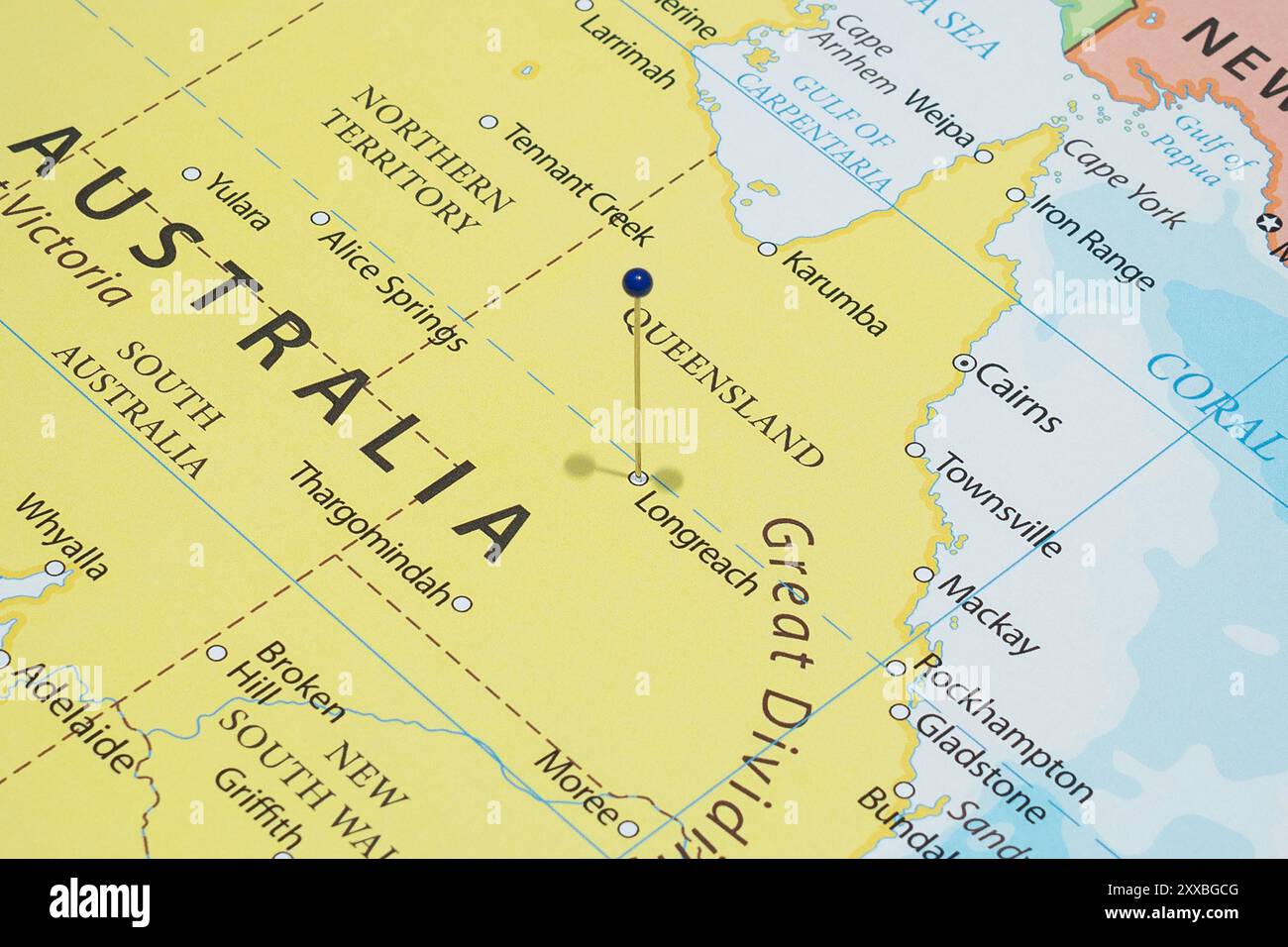 Close up to a Longreach city with a blue pin needle into Australia ...