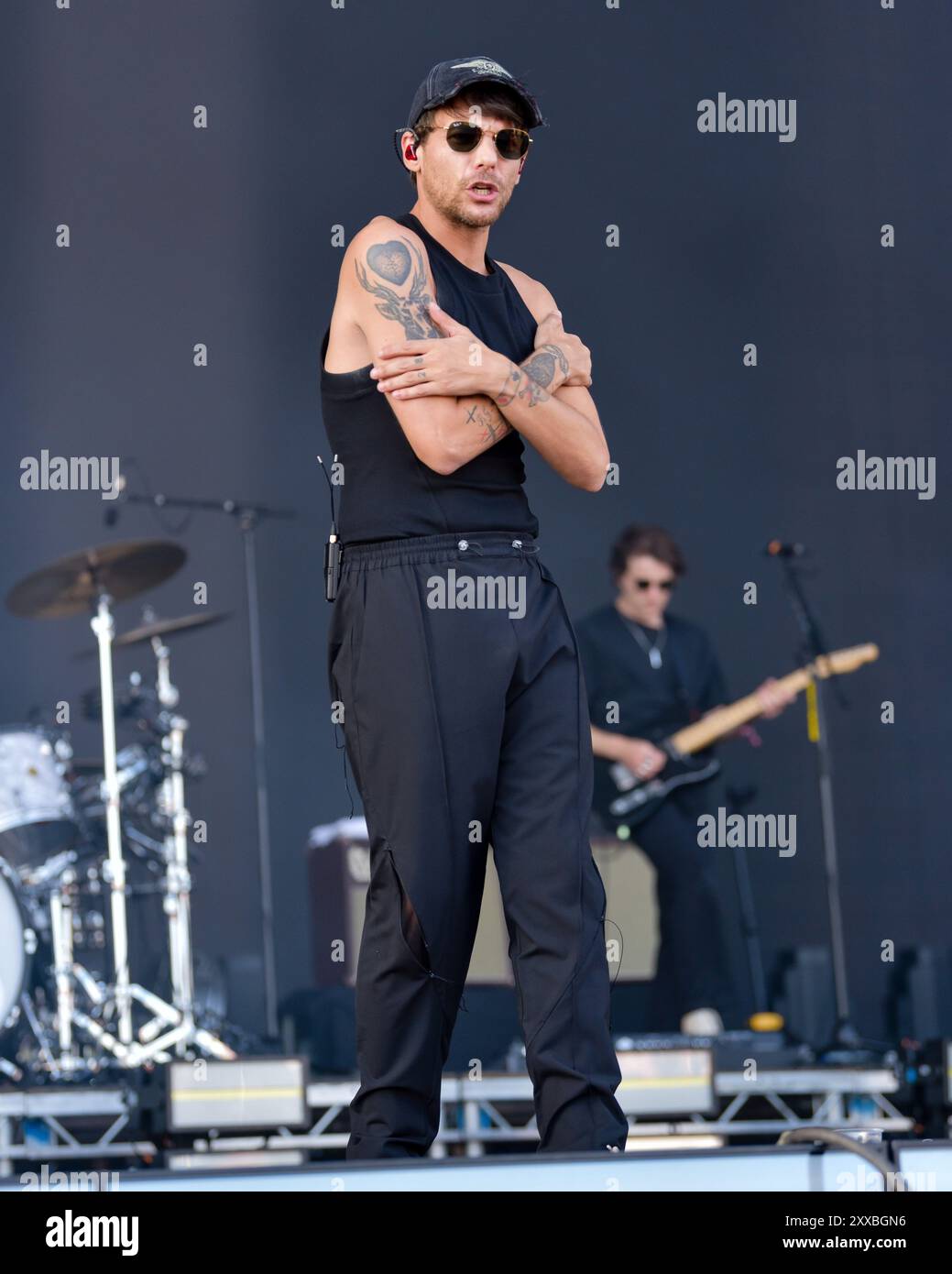 Louis Tomlinson, of One Direction, delights his huge crowd of fans, at ...