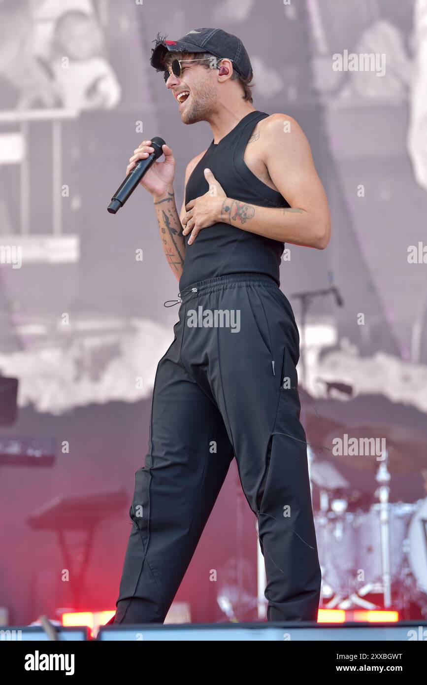 Louis Tomlinson, of One Direction, delights his huge crowd of fans, at ...