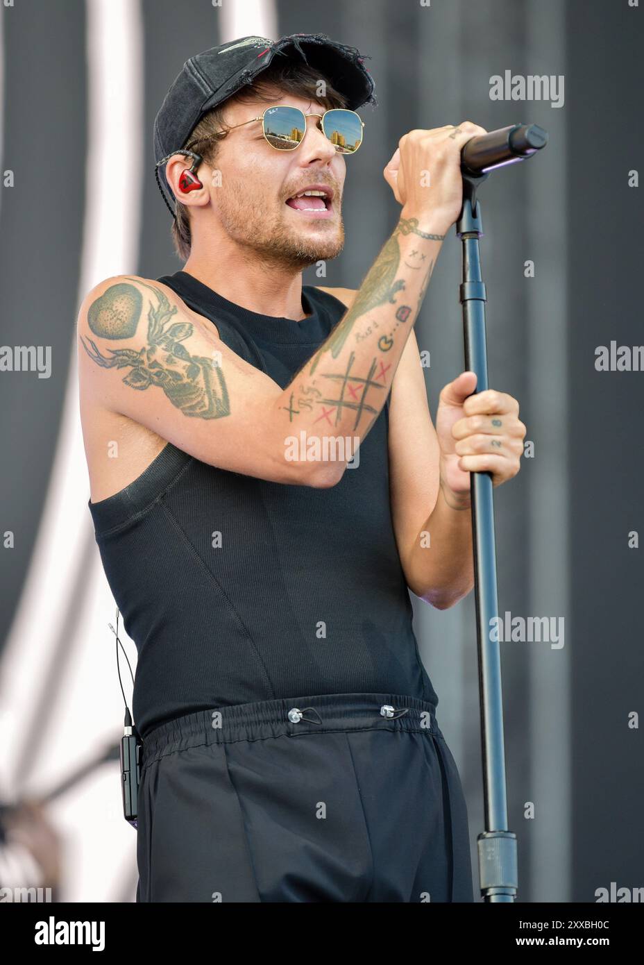 Louis Tomlinson, of One Direction, delights his huge crowd of fans, at ...
