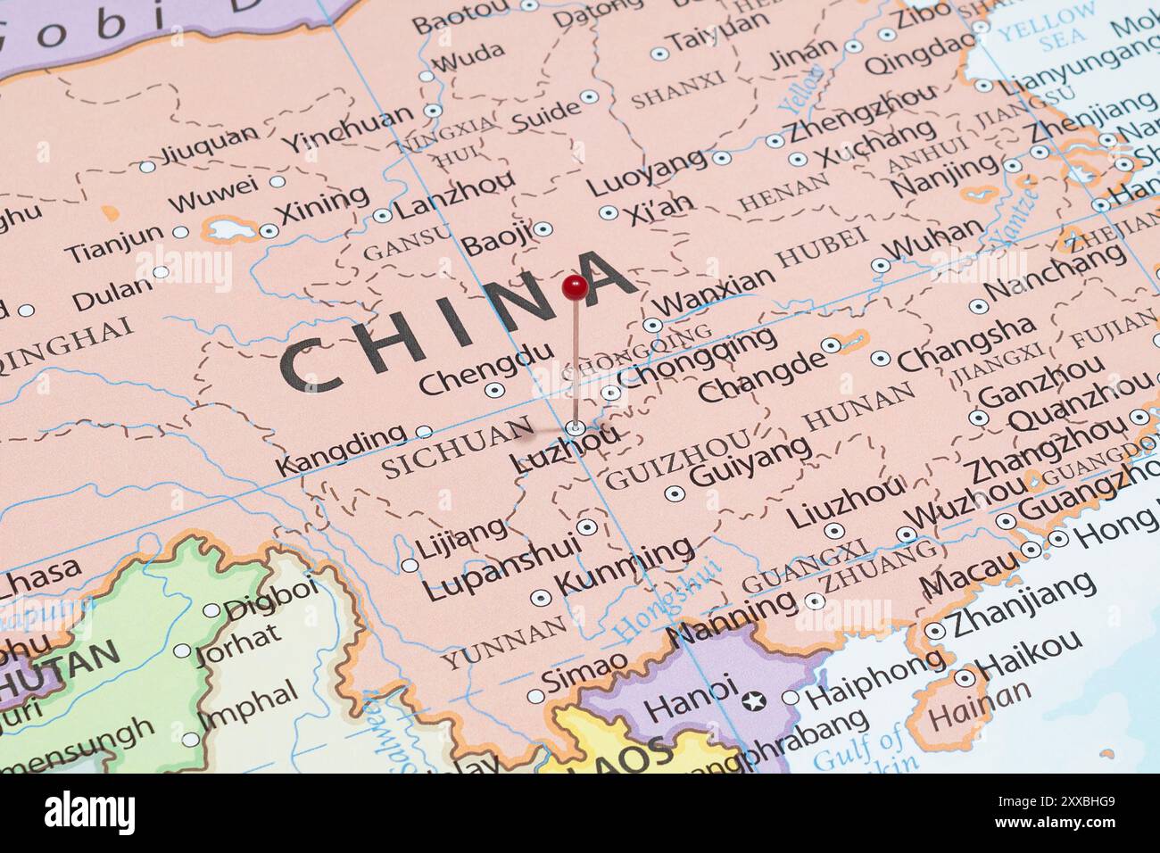 Close up to a Luzhou city with a red pin needle into China country ...