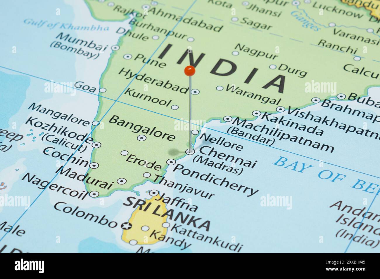 Close up to a Madras city with an orange pin needle into India country ...