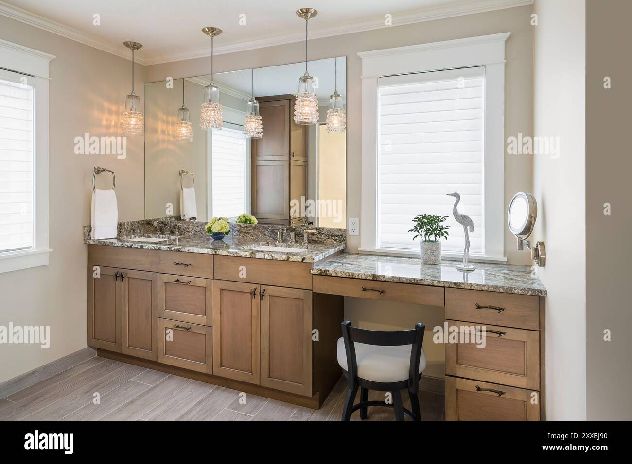 Double bathroom vanity with warm wood stain and make-up counter Stock ...
