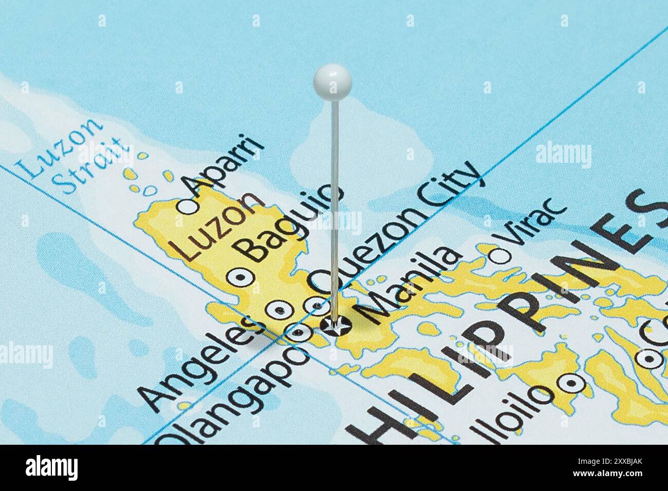 Close up to a Manila city with a white pin needle into Philippines ...