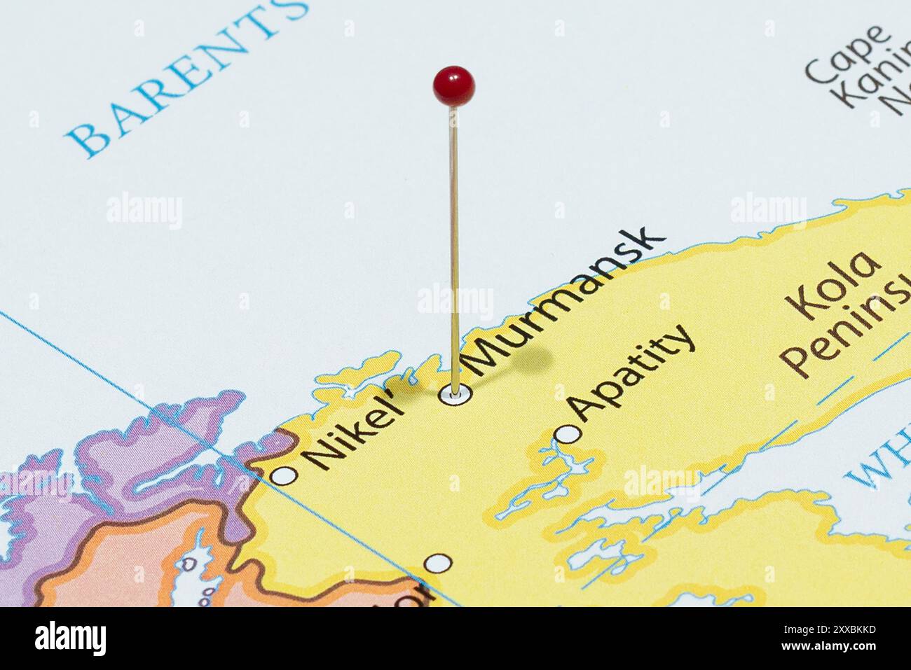Close up to a Murmansk city with a red pin needle into Russia country ...