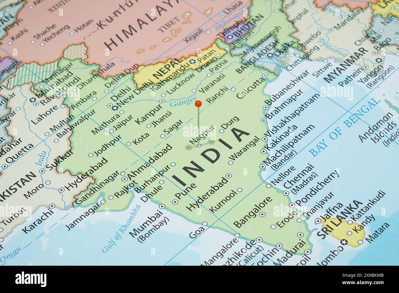 Close up to a Nagpur city with an orange pin needle into India country ...