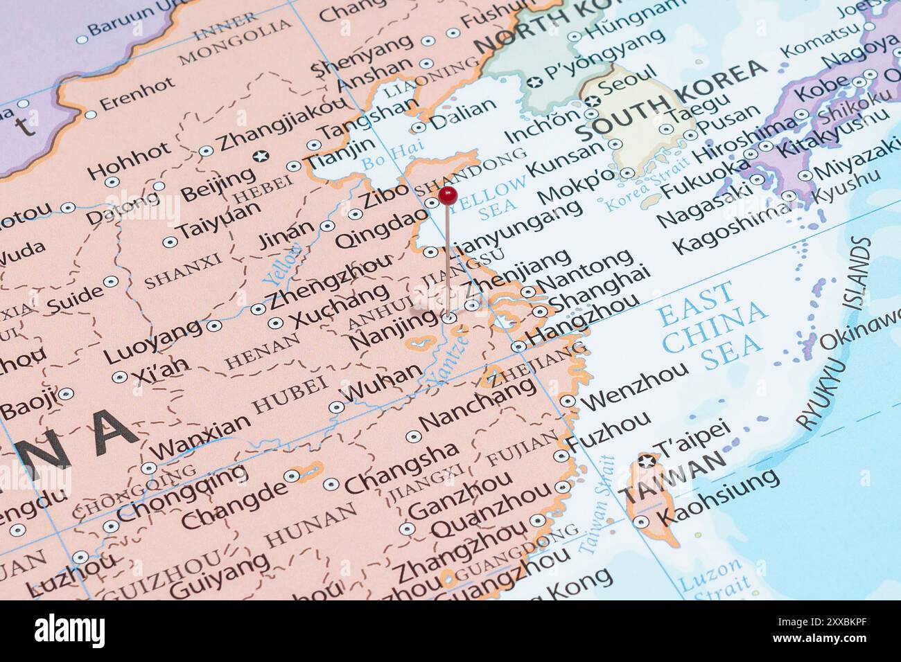 Close up to a Nanjing city with a red pin needle into China country ...