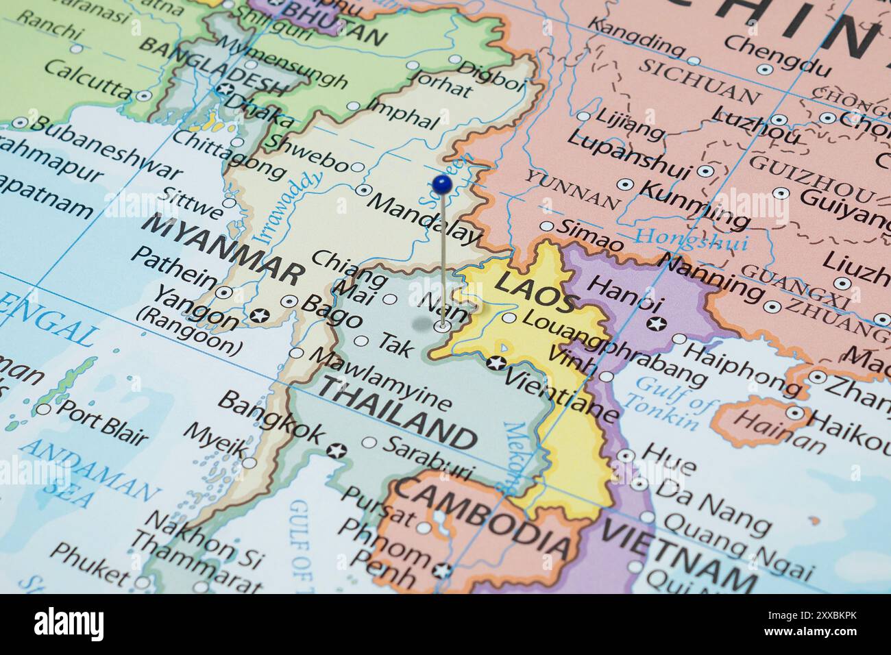 Close up to Nan city with a blue pin needle into Thailand country ...