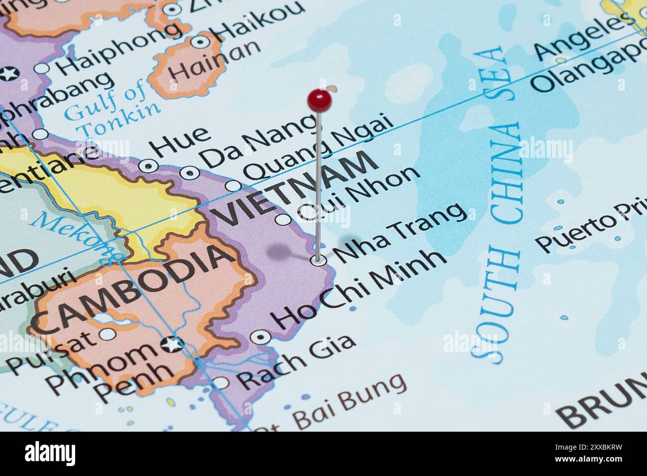 Close up to a Nha Trang city with a red pin needle into Vietnam country ...