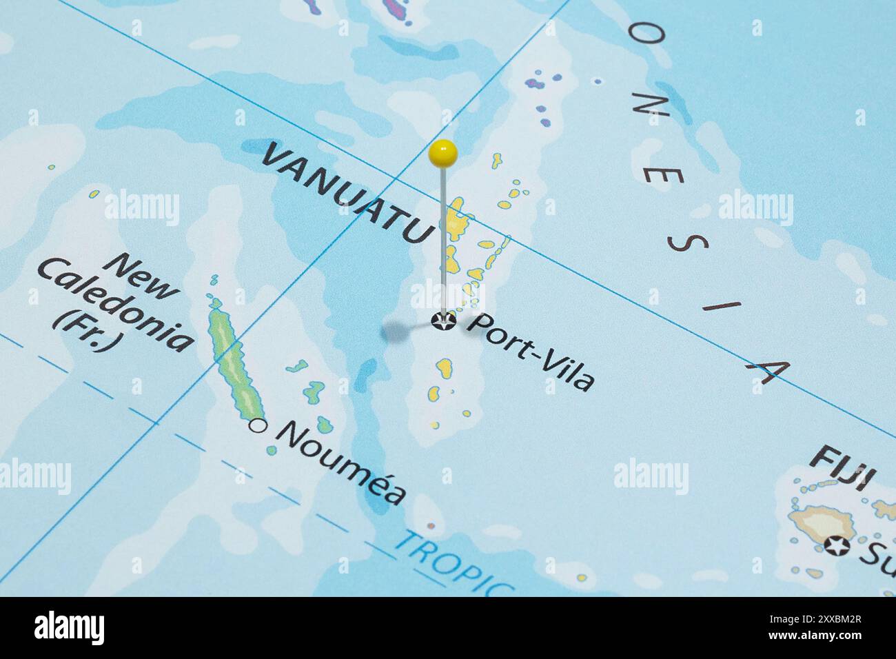 Close up to a Port Vila city with a yellow pin needle into Vanuatu ...
