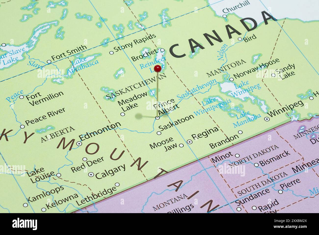 Close up to a Prince Albert city with a red pin needle into Canada ...