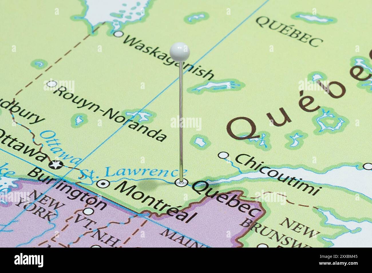 Close up to a Quebec city with a white pin needle into Canada country ...