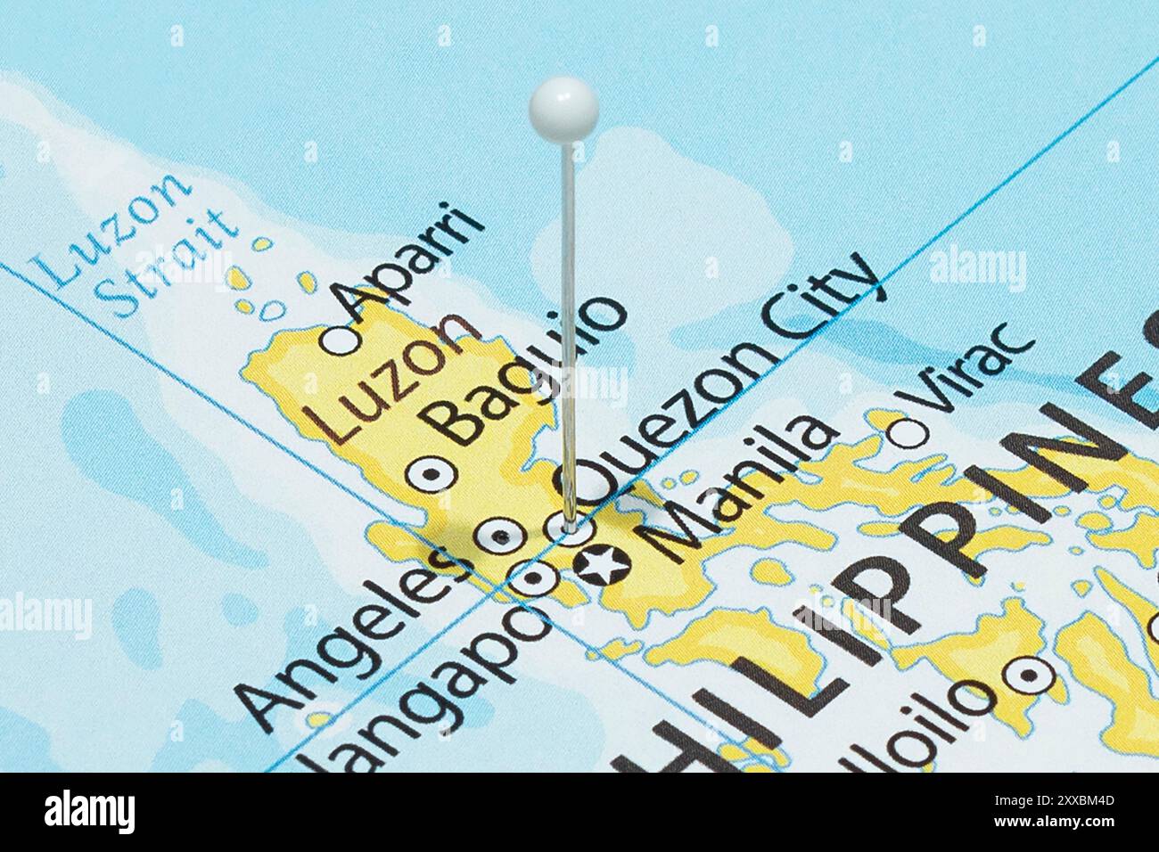 Close up to a Quezon City with a white pin needle into Philippines ...