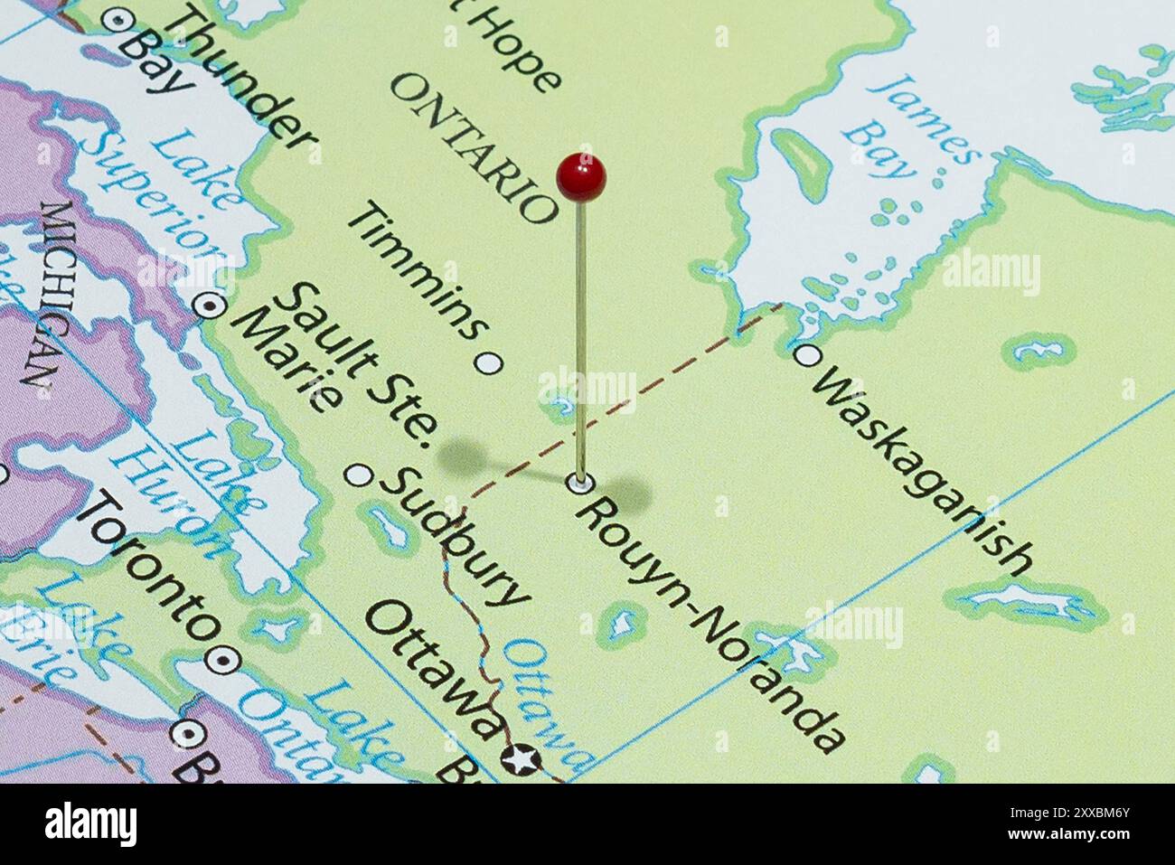 Close up to a Rouyn noranda city with a red pin needle into Canada ...