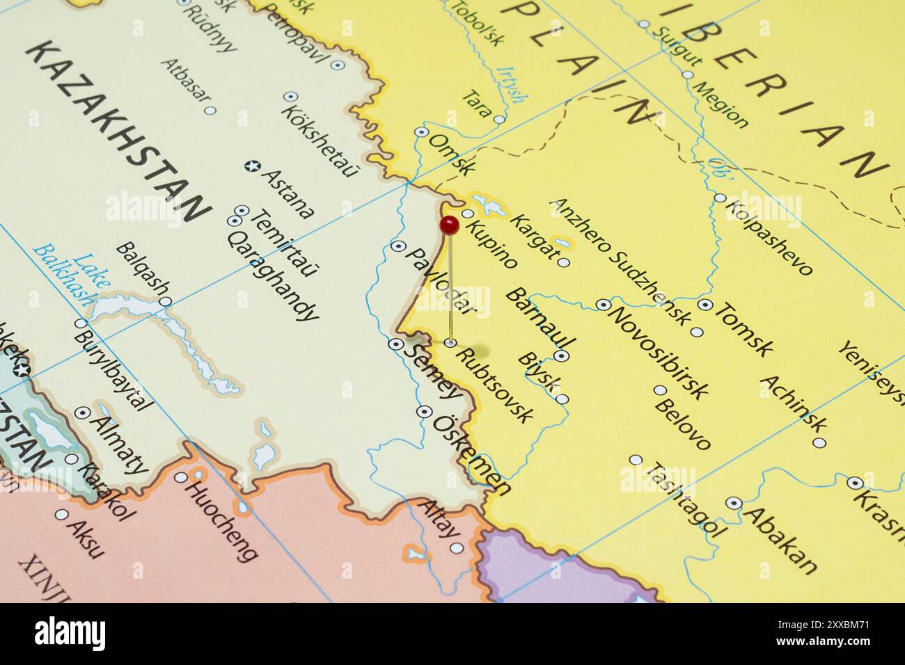 Close up to a Rubtsovsk city with a white pin needle into Russia ...