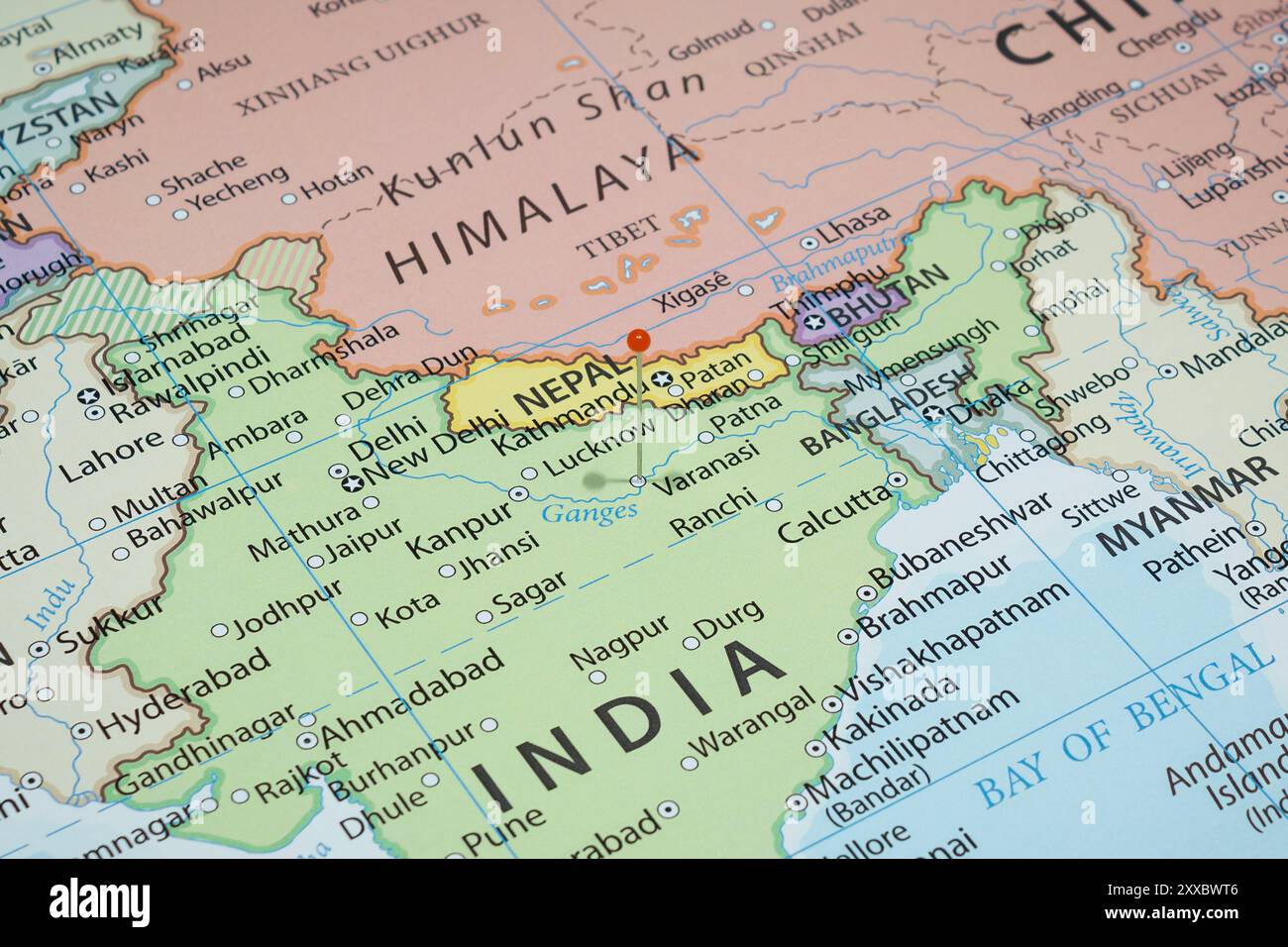 Close up to a Varanasi city with an orange pin needle into India ...