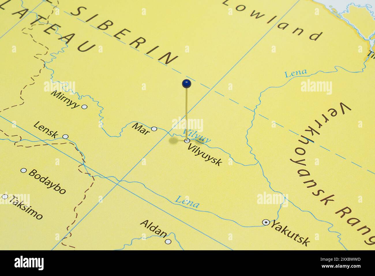 Close up to a Vilyuysk city with a blue pin needle into Russia country ...