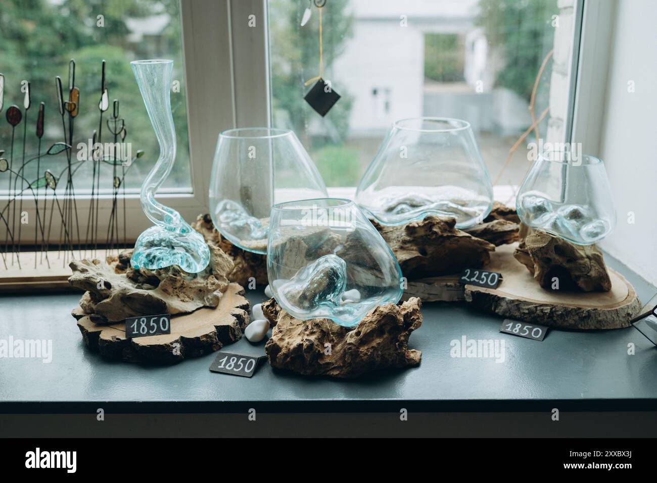 decorative glass vases mounted on natural wooden bases. These vases of ...