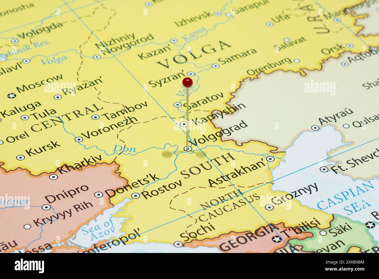 Close up to a Volgograd city with a red pin needle into Russia country ...