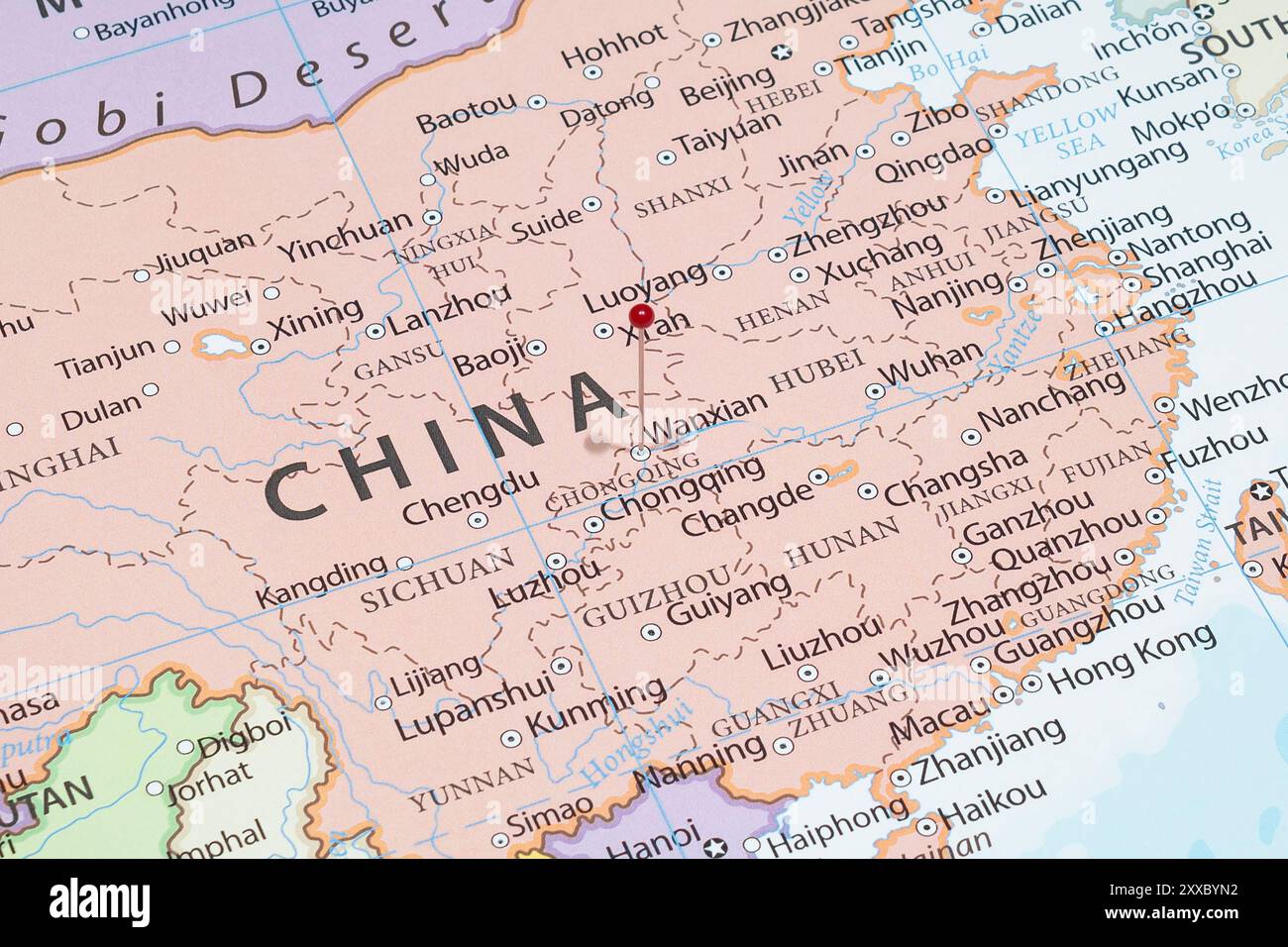 Close up to a Wanxian city with a red pin needle into China country ...