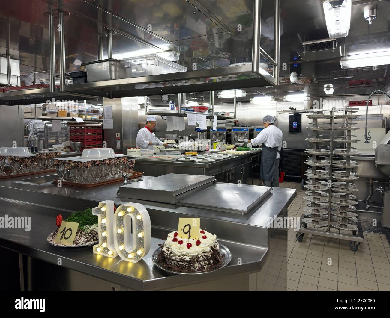 Two chefs on the cruise ship Discovery Princess at work in the galley ...