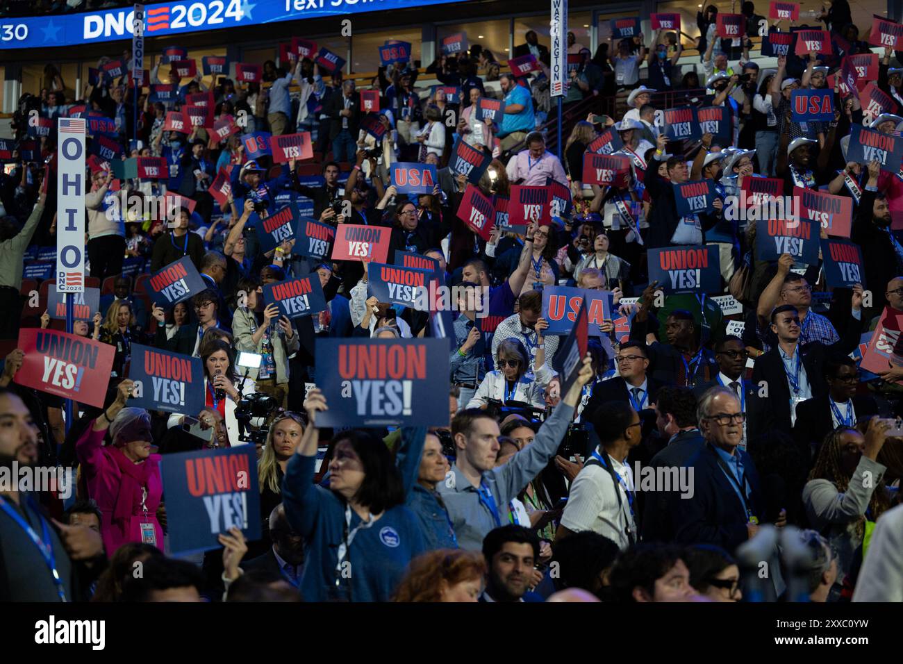 Chicago, United States Of America. 19th Aug, 2024. DNC attendees hold ...