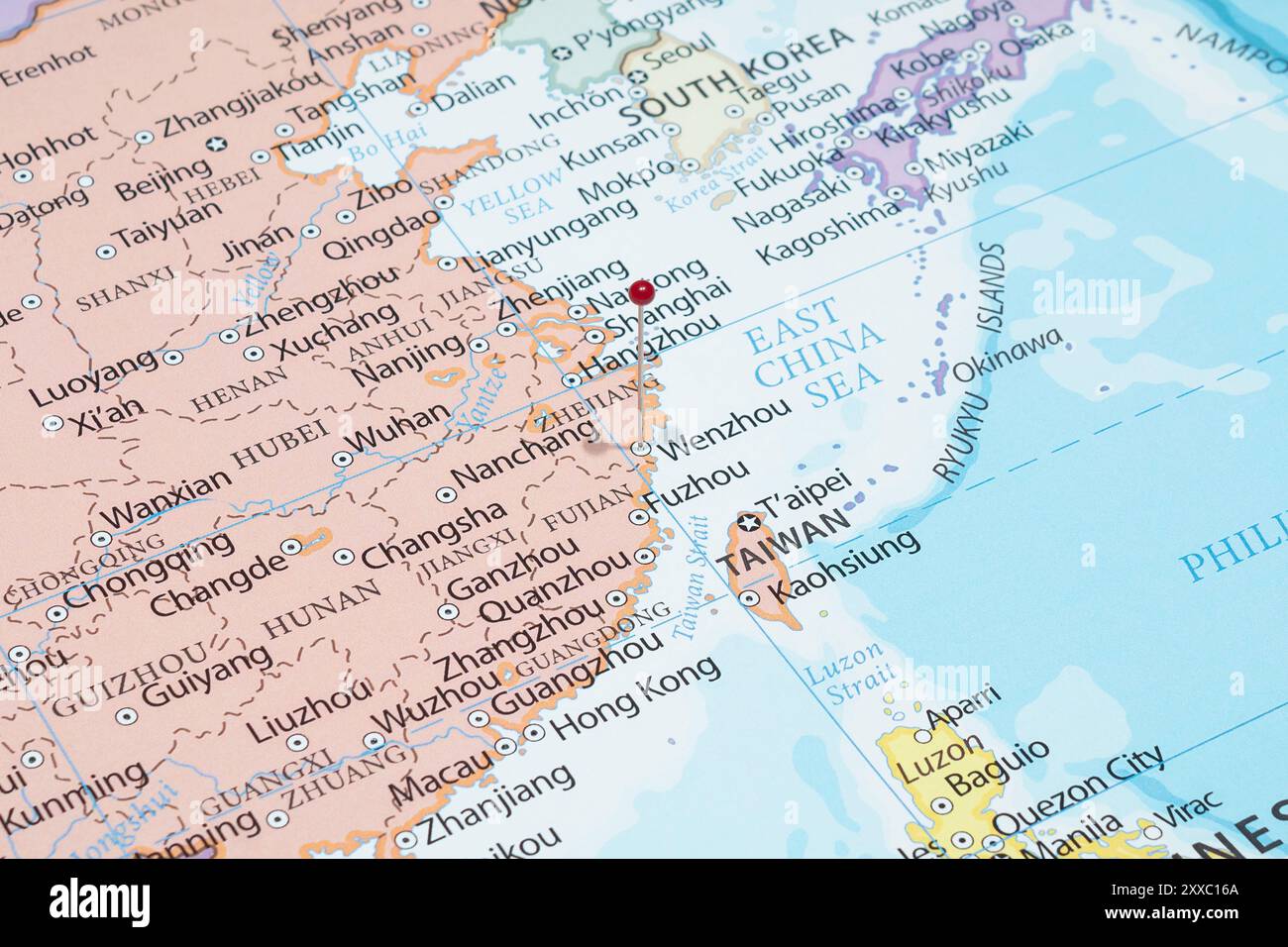 Close up to a Wenzhou city with a red pin needle into China country ...