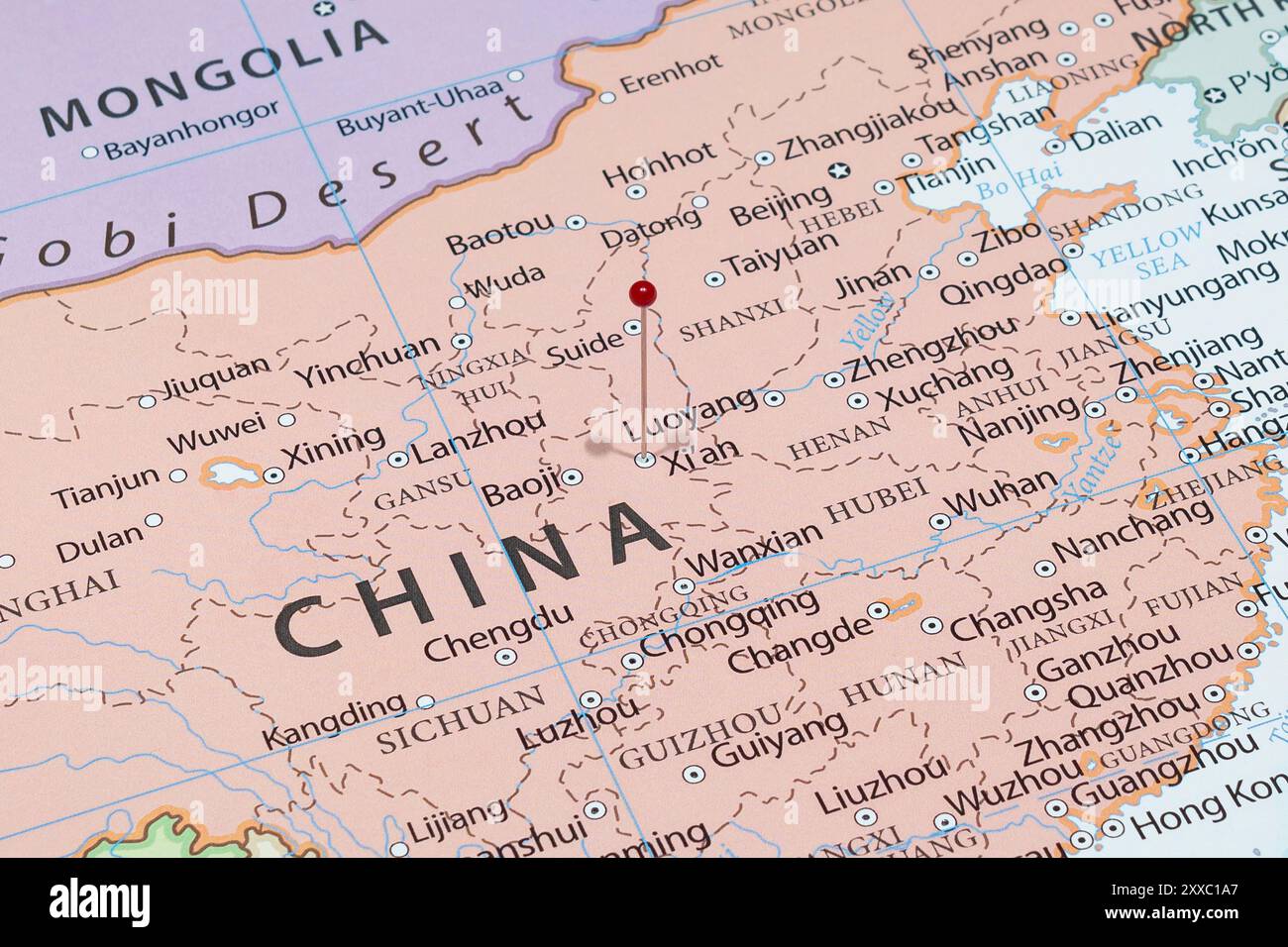 Close up to a Xian city with a red pin needle into China country ...