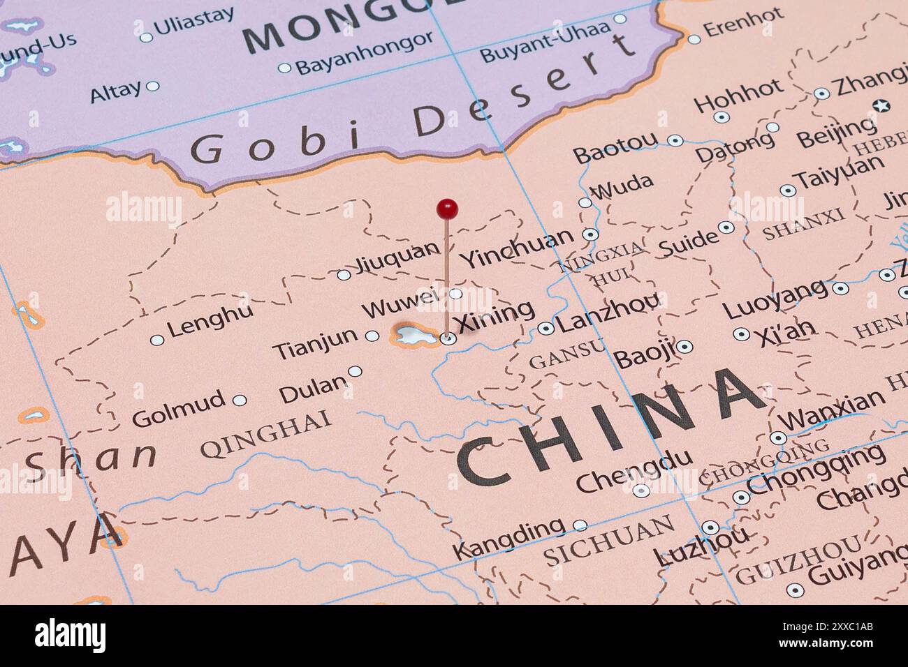 Close up to a Xining city with a red pin needle into China country ...