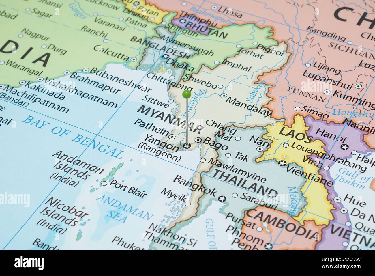 Close up to a Yangon city with a green pin needle into Myanmar country ...