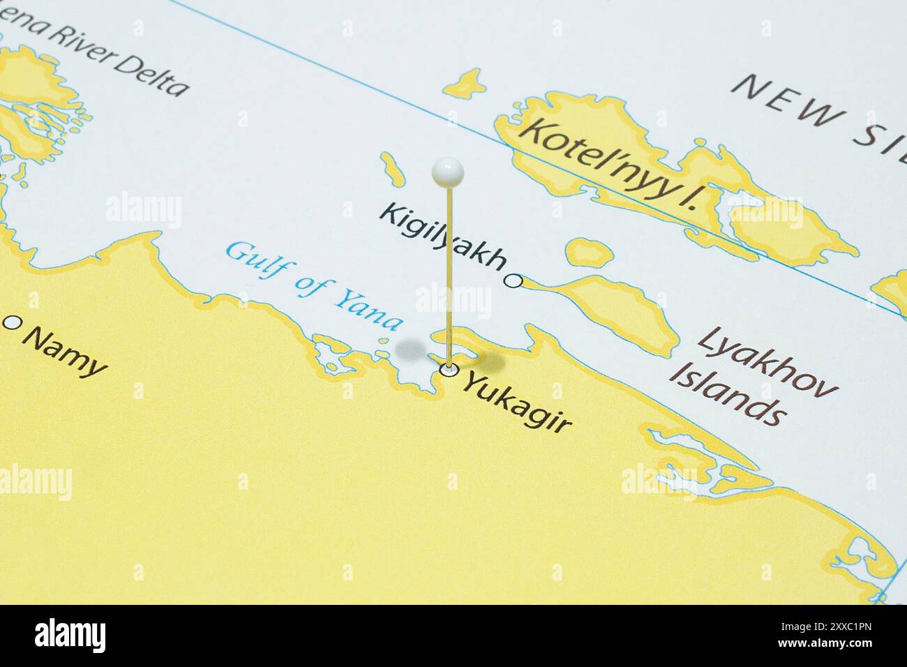 Close up to a Yukagir city with a white pin needle into Russia country ...