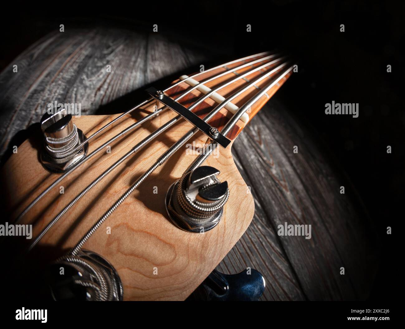 bass guitar headstock tuning post fisheye on wood background Stock ...