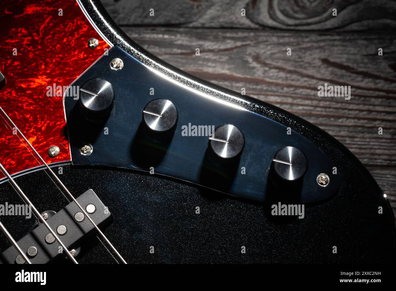 bass guitar preamp knobs on wood background top view Stock Photo - Alamy