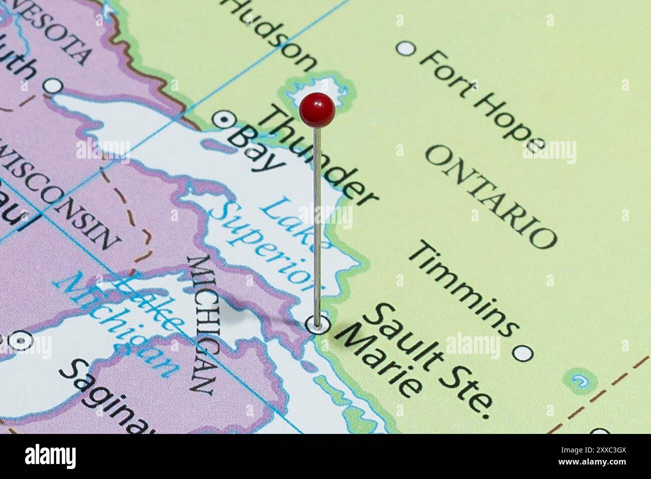 Close up to a Sault Ste Marie with a red pin needle into Canada country ...