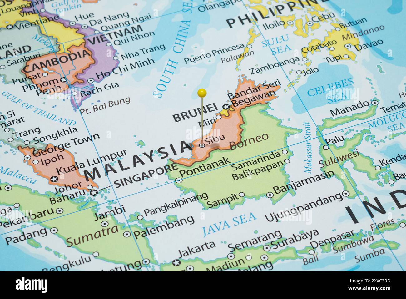 Close up to a Sibu city with a yellow pin needle into Malaysia country ...