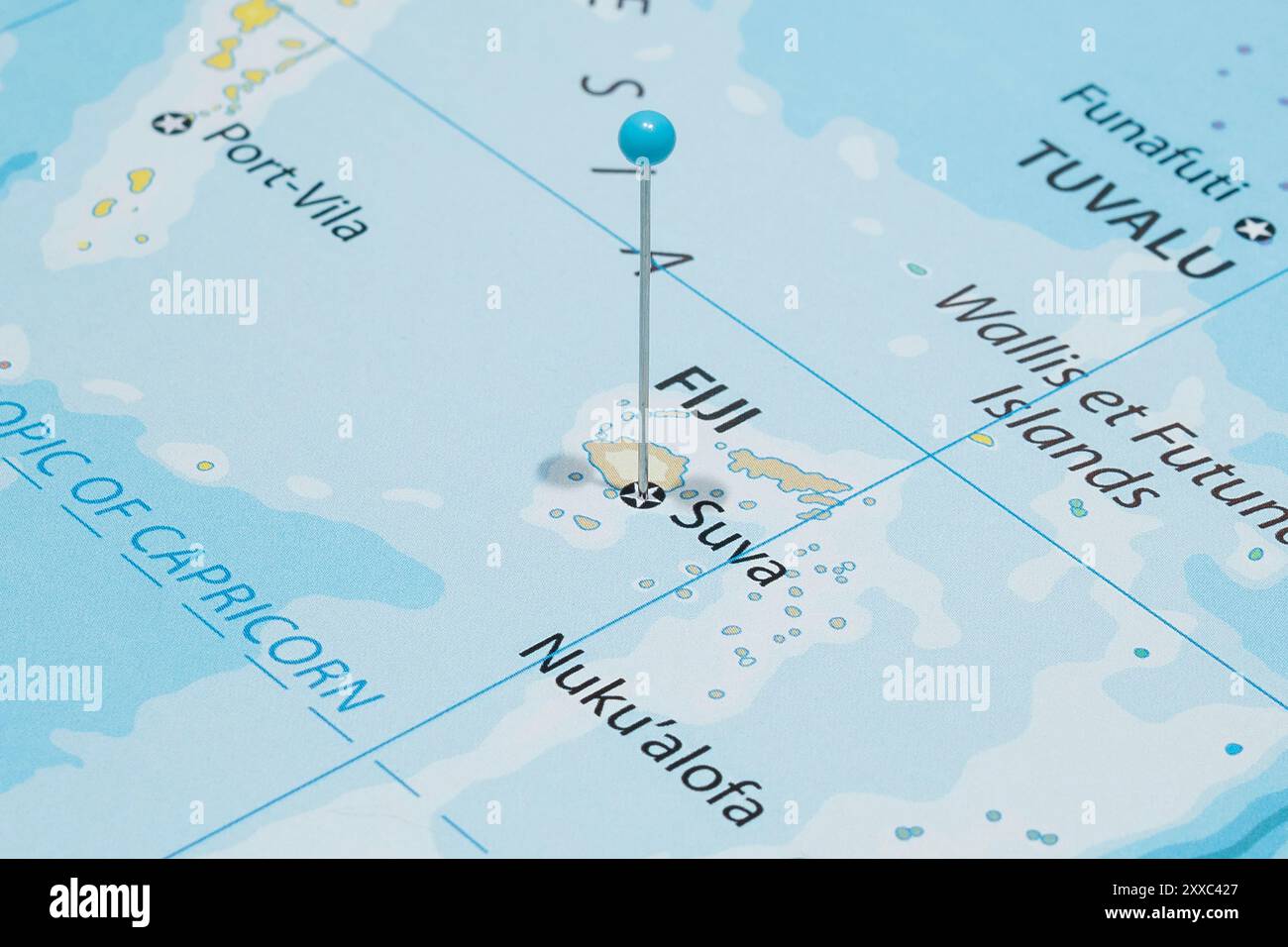 Close up to a Suva city with a blue light pin needle into Fiji country ...