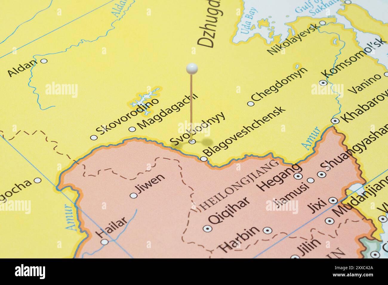 Close up to a Svobodny city with a white pin needle into Russia country ...