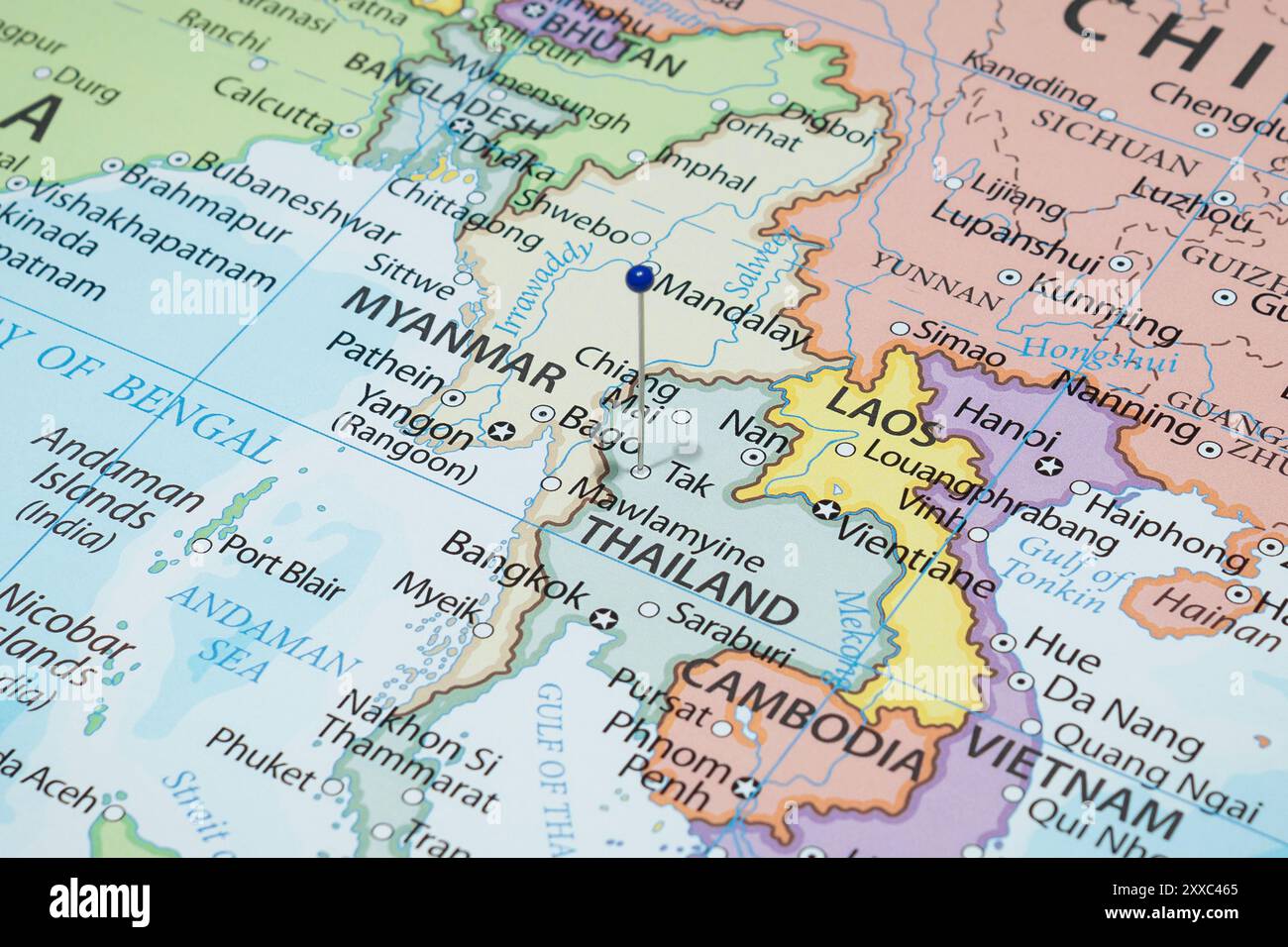 Close up to a Tak city with a blue pin needle into Thailand country ...